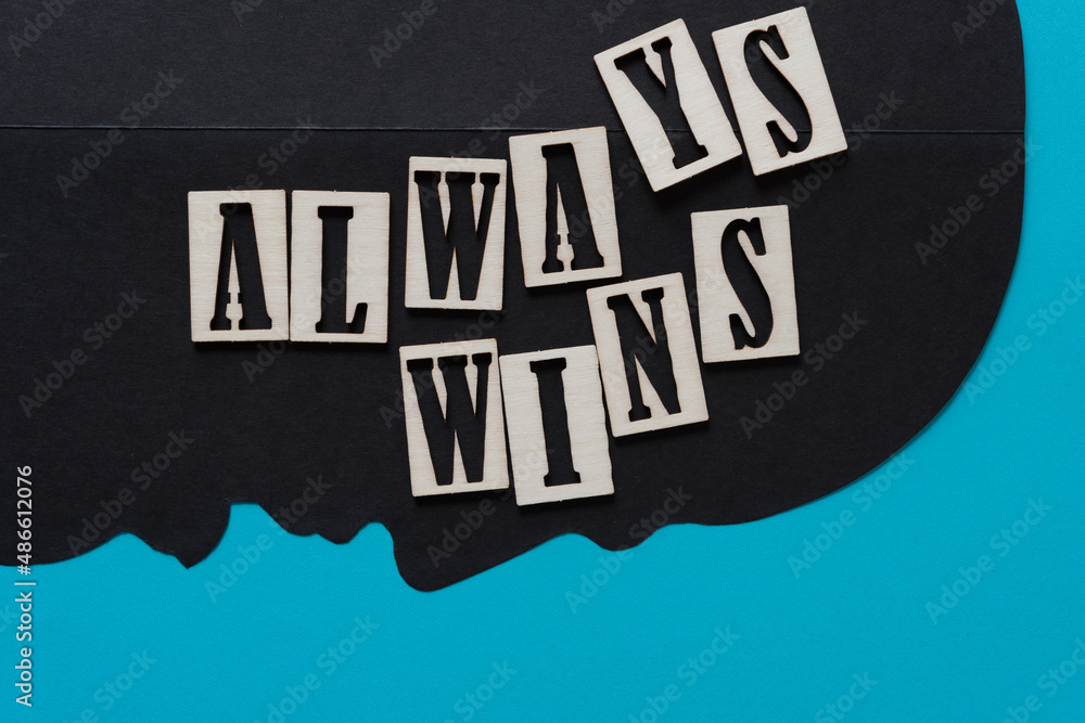 sign with profile and the words "always wins" on a paper surface Stock ...