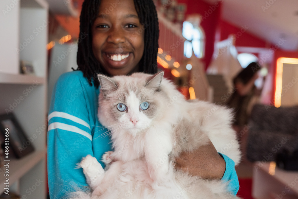 Black girl with big cat Stock Photo | Adobe Stock