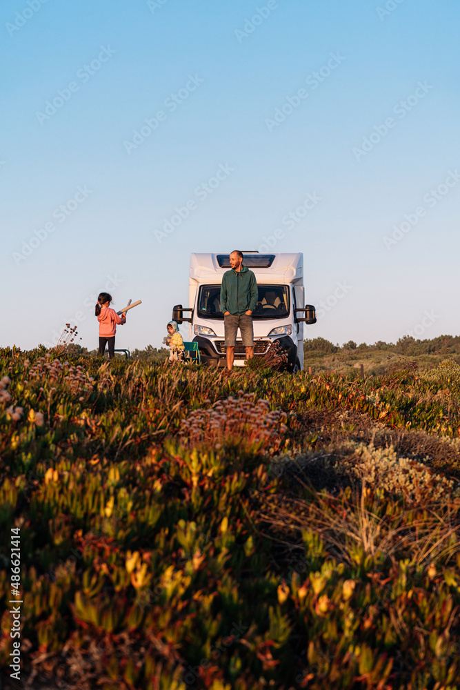 Happy family with RV motorhome outdoors Stock Photo | Adobe Stock