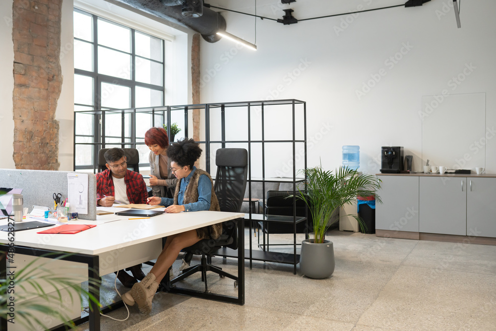 Teamwork Between Coworkers At Office Desk Stock Photo | Adobe Stock