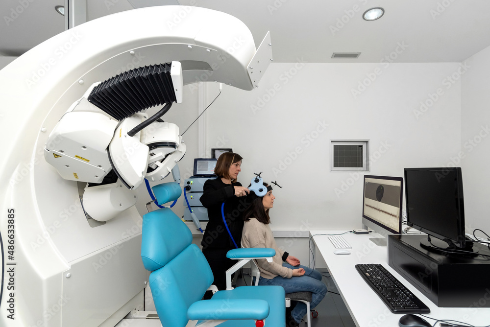 Researcher analyzing brain of patient with TMS Stock Photo | Adobe Stock