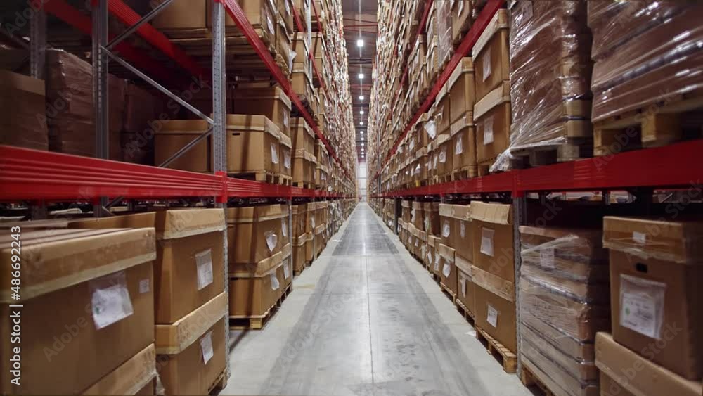 A warehouse with many boxes on its shelves waiting for export. Supply ...