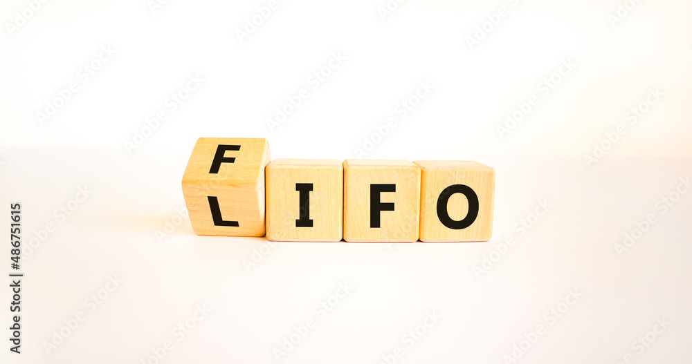 LIFO or FIFO last in first out symbol. Changed concept words LIFO to FIFO on wooden blocks ...