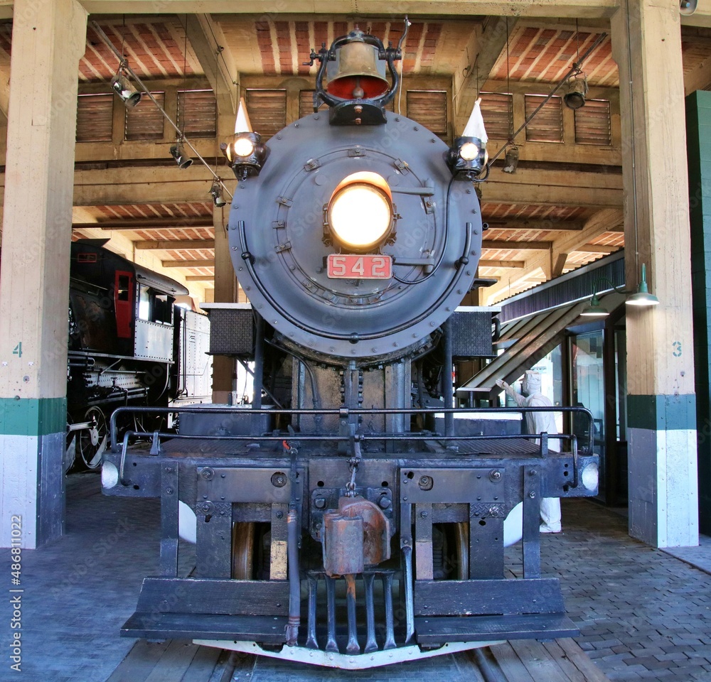 Vintage steam locomotive with the head lamp burning sitting on the ...