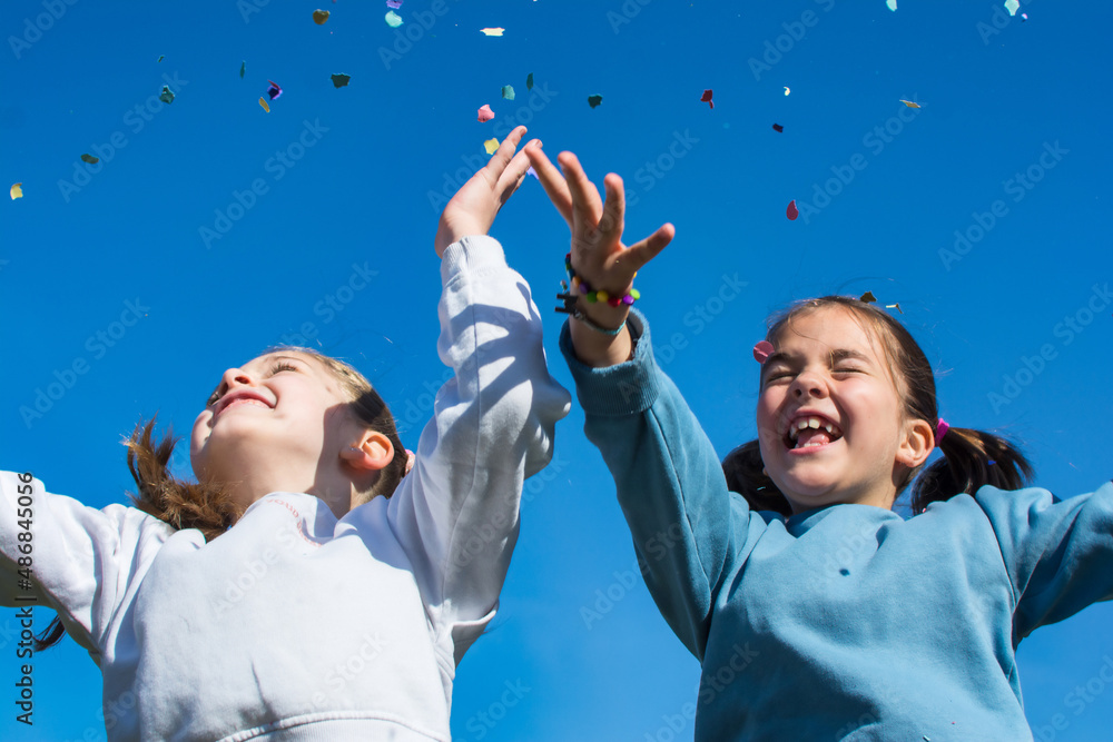 Two Cute Little Girls Celebrating And Playing With Confetti. Girls With ...