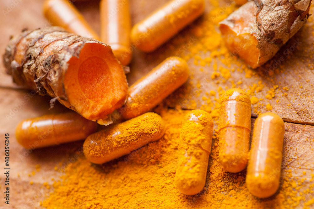 Raw organic turmeric root with powder and medicine herbal vitamin ...