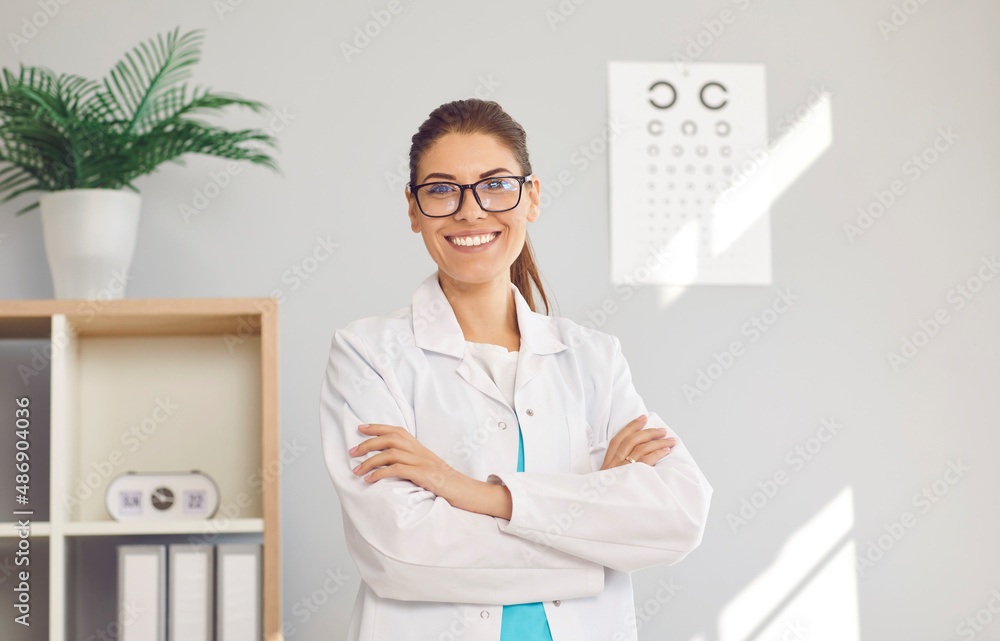 Stockfoto Portrait of happy young Caucasian female optician in white ...