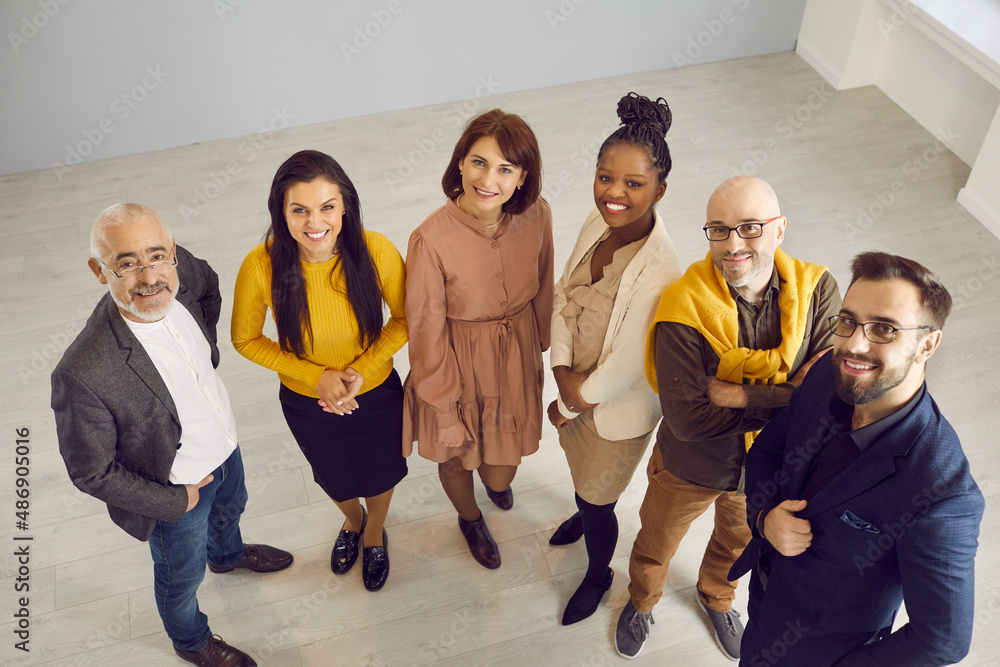 Top view portrait of smiling diverse multiethnic employees look at ...