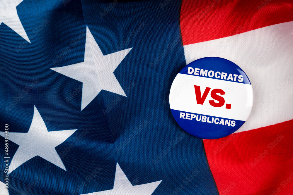 democrats vs republicans text quote on election button laying on the ...