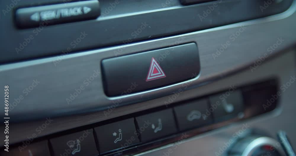 Pressing the car's emergency stop button. Pressing the car emergency ...