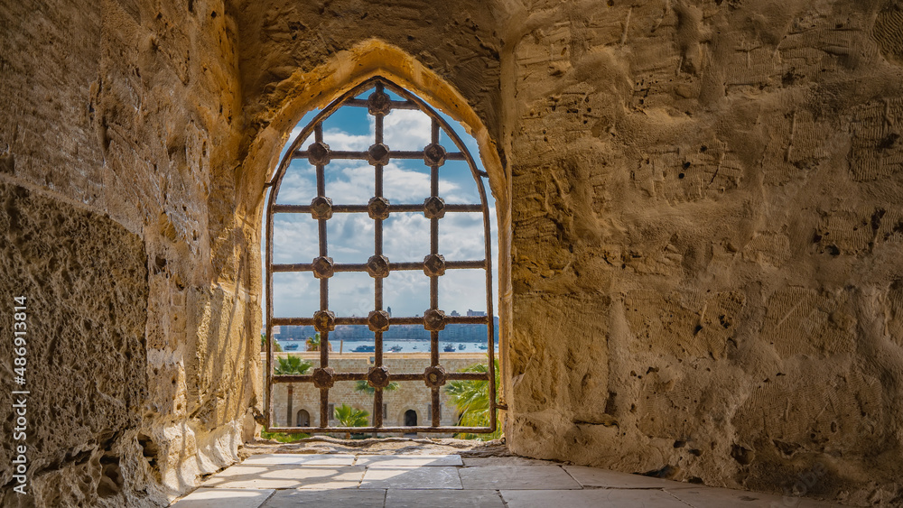 The window opening in the ancient Citadel of Qaitbay is barred. The ...