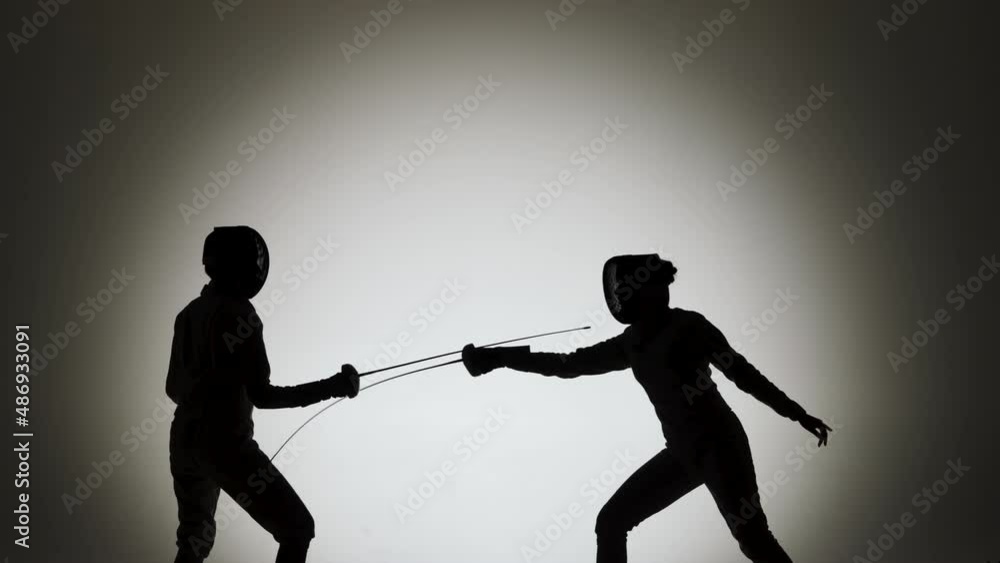 Black silhouettes of two female swordsmen fighting a duel. Athletes ...