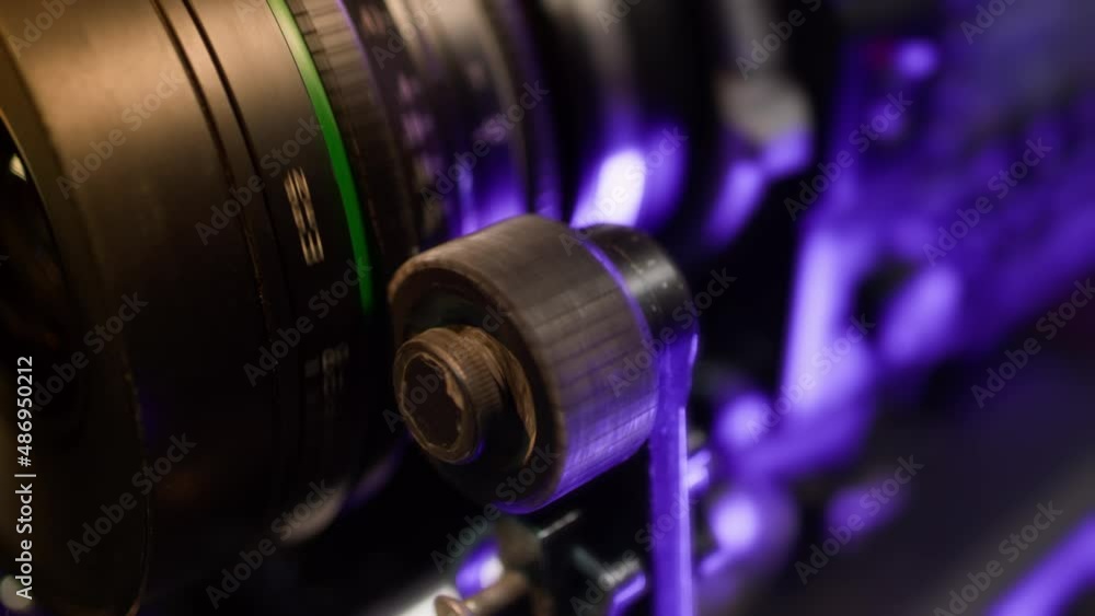 The lens focal length scale rotates with the follow focus gear in close ...