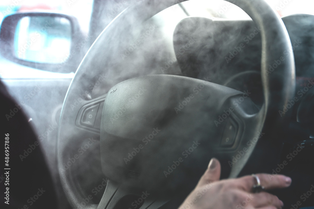 Smoke from the engine or cigarettes inside the car. Bad vehicle cab ...