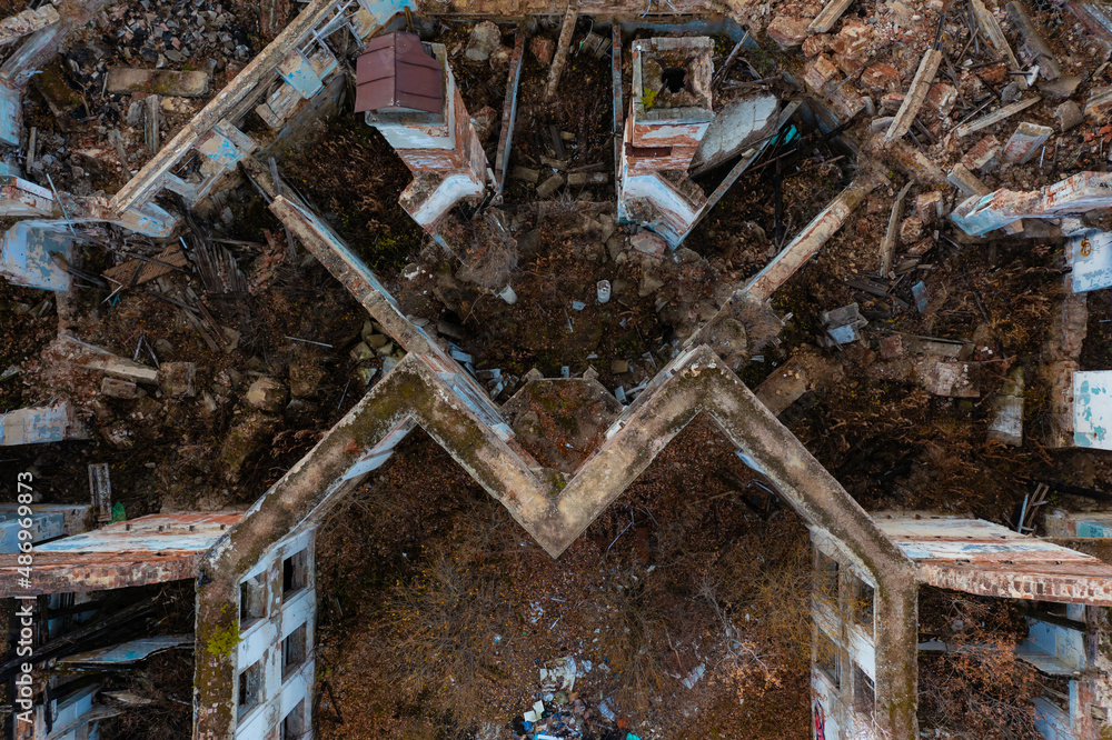 vertical downward view of the walls of an abandoned and destroyed ...