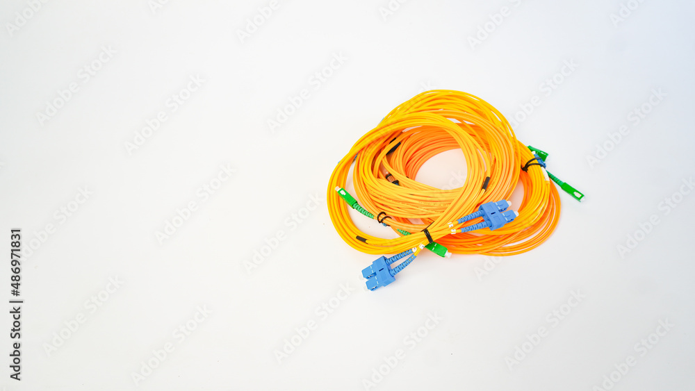 Fiber optic cables isolated on white background.Yellow optic cable with ...