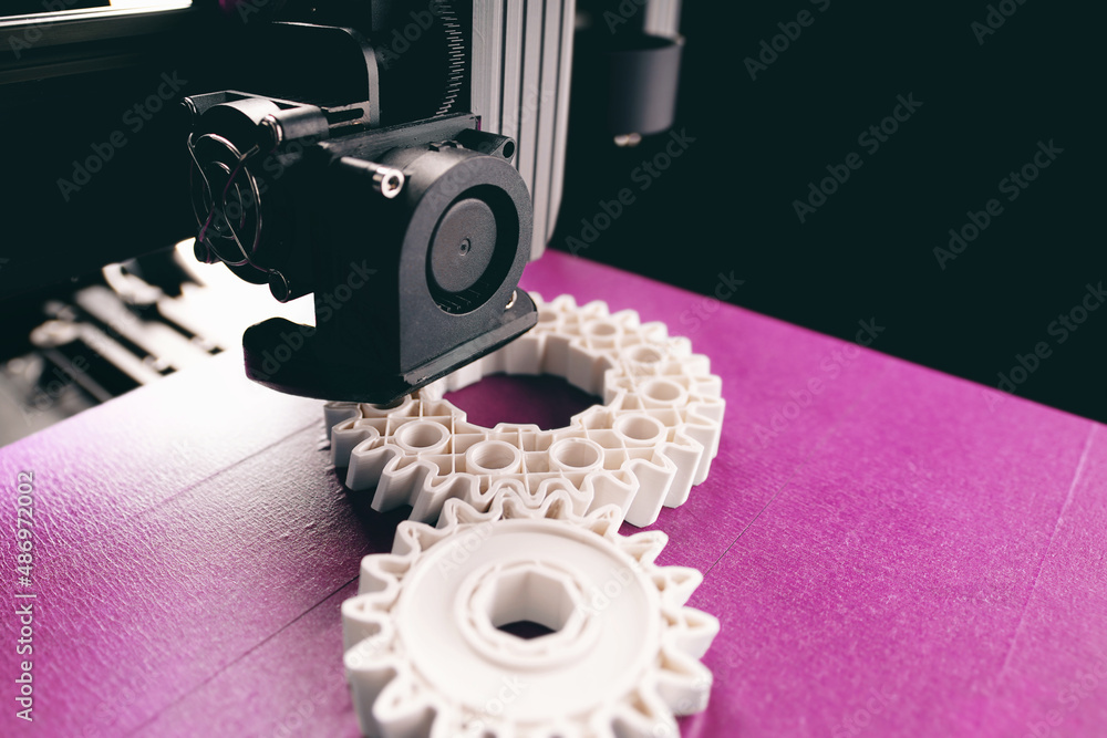opblique view on process of 3D-printing. print head, bright pink print ...