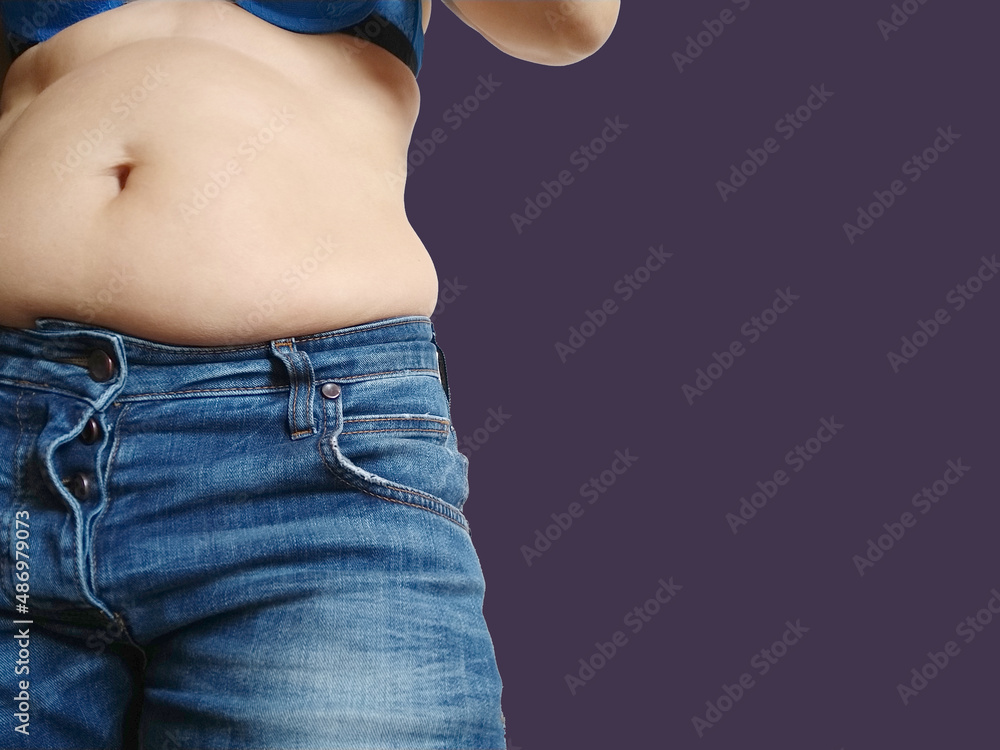 Saggy belly. Folds of leather and fat on the side hanging over the ...