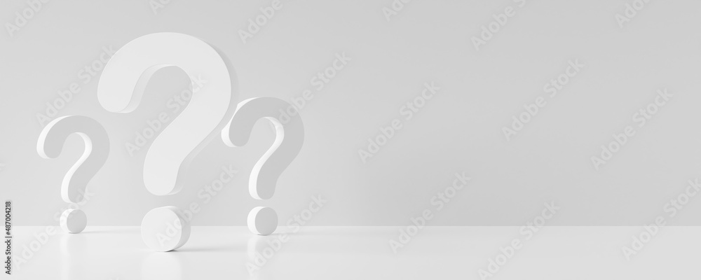 Group of big and small white question mark signs on white room ...