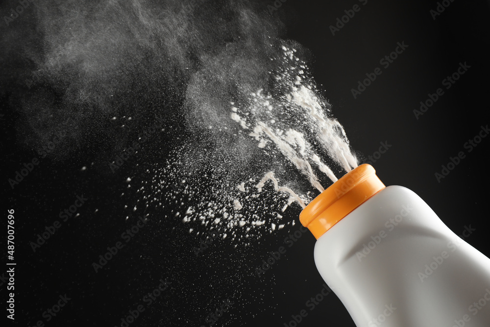 Scattering of dusting powder on black background Stock Photo | Adobe Stock