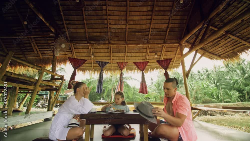 The happy family eat and drink tasty beverages spending time in local ...