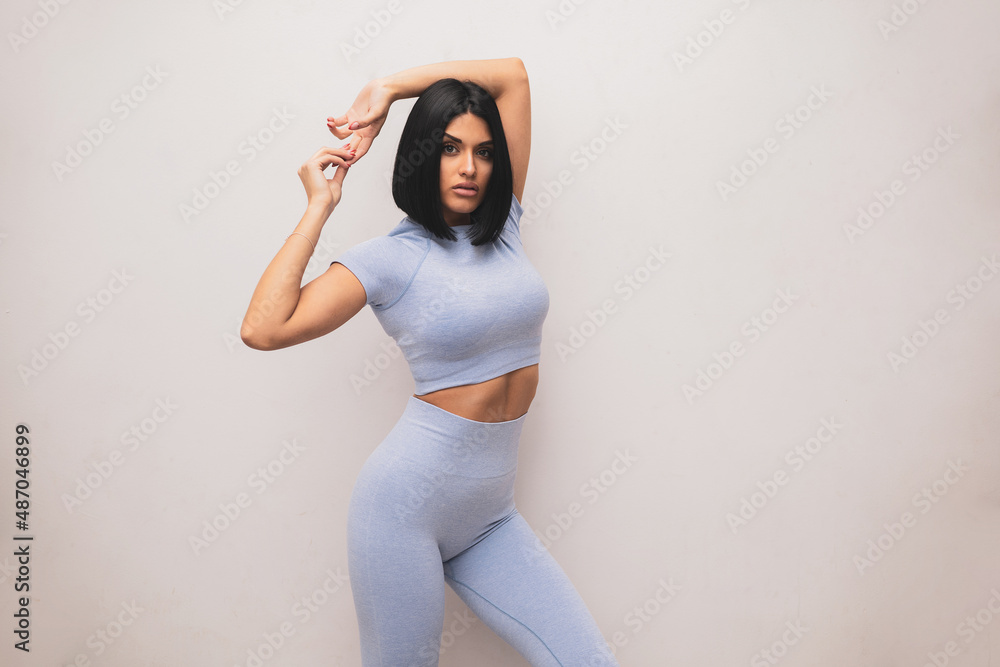 Sporty girl posing. Photo of fitness model isolated on white background ...