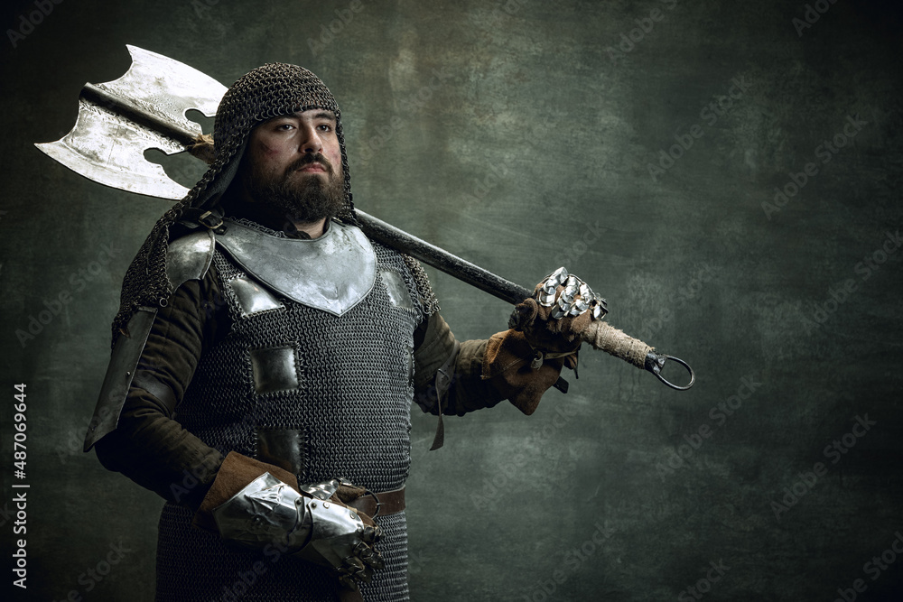 Vintage portrait of brutal seriuos man, medieval warrior or knight with ...
