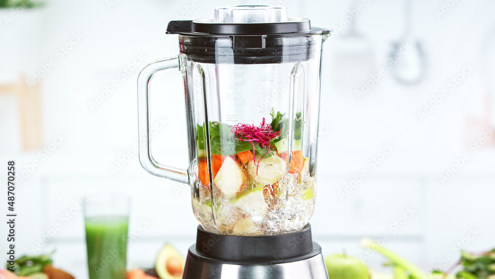 Mixing pieces of fruits and in blender. Preparation of healthy drink ...
