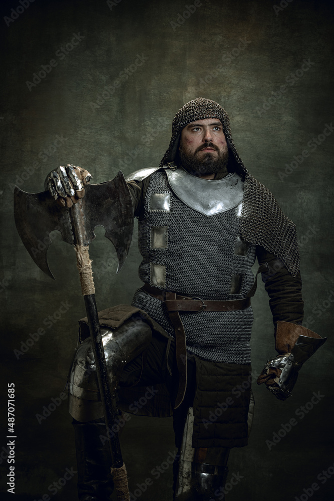 Vintage portrait of brutal seriuos man, medieval warrior or knight with ...