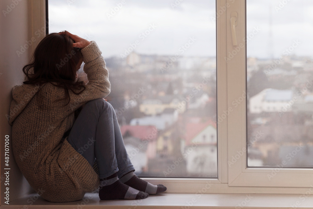 Sad Teenage Girl Looking Out Window