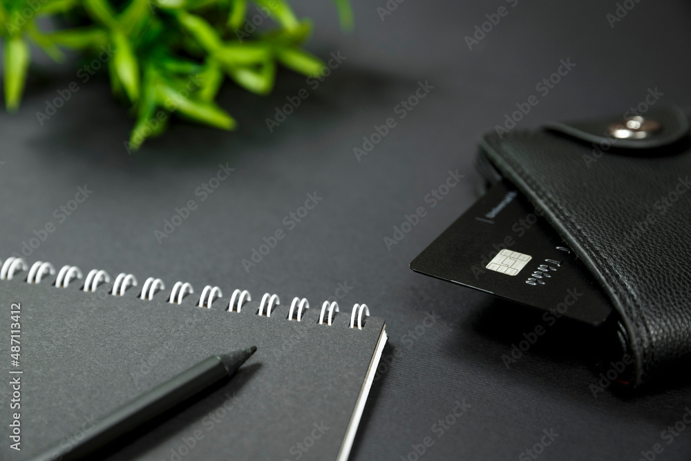Credit card in a wallet on a black background Stock Photo | Adobe Stock