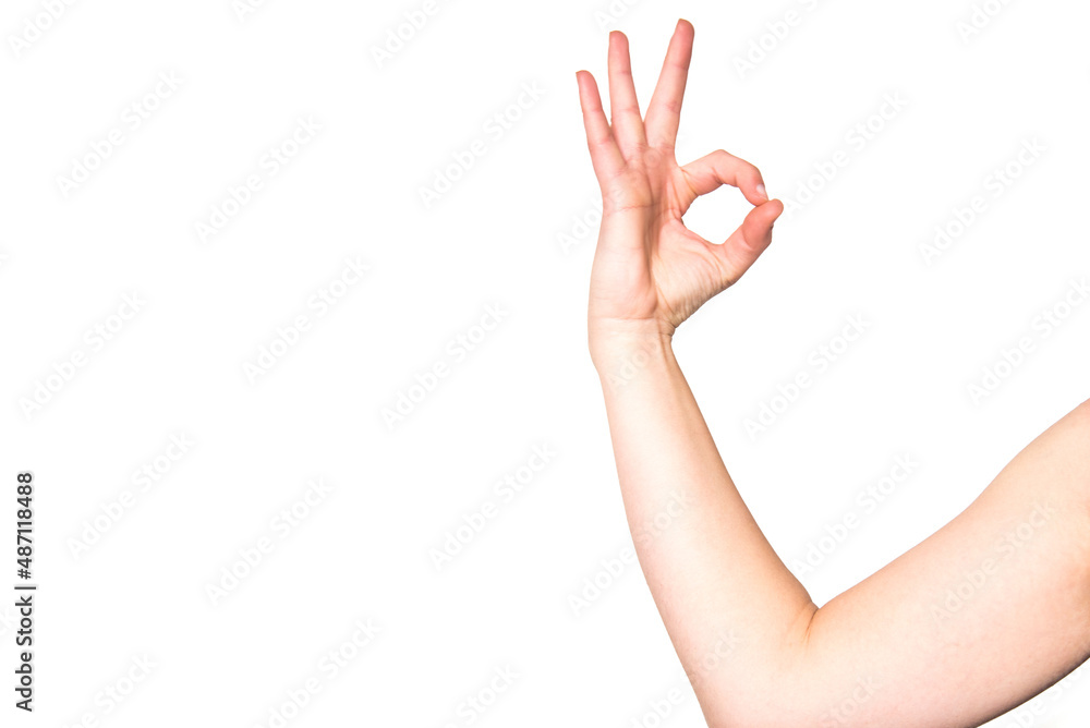 Un brazo de una mujer haciendo el gesto con la mano del número cero ...