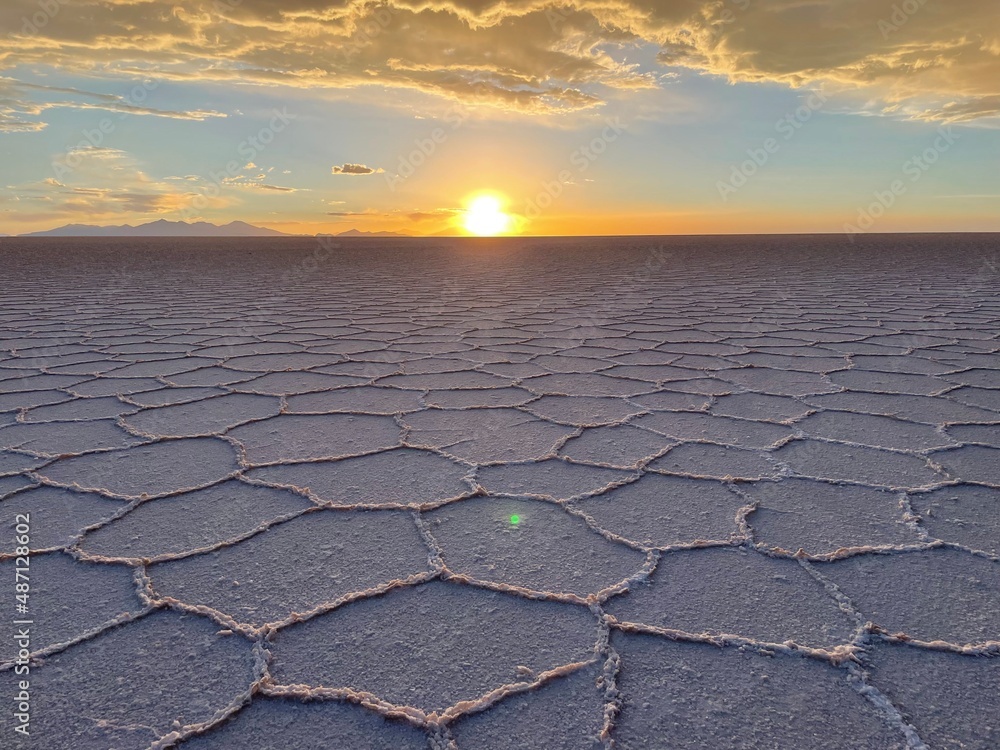 Pan view of landscape with hexagonal salt formations on surface of ...