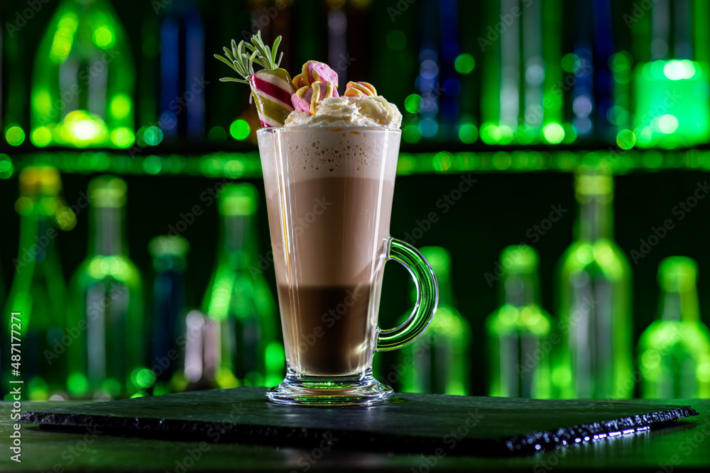 Cocktail layered baileys irish cream iced coffee on bar counter in a ...