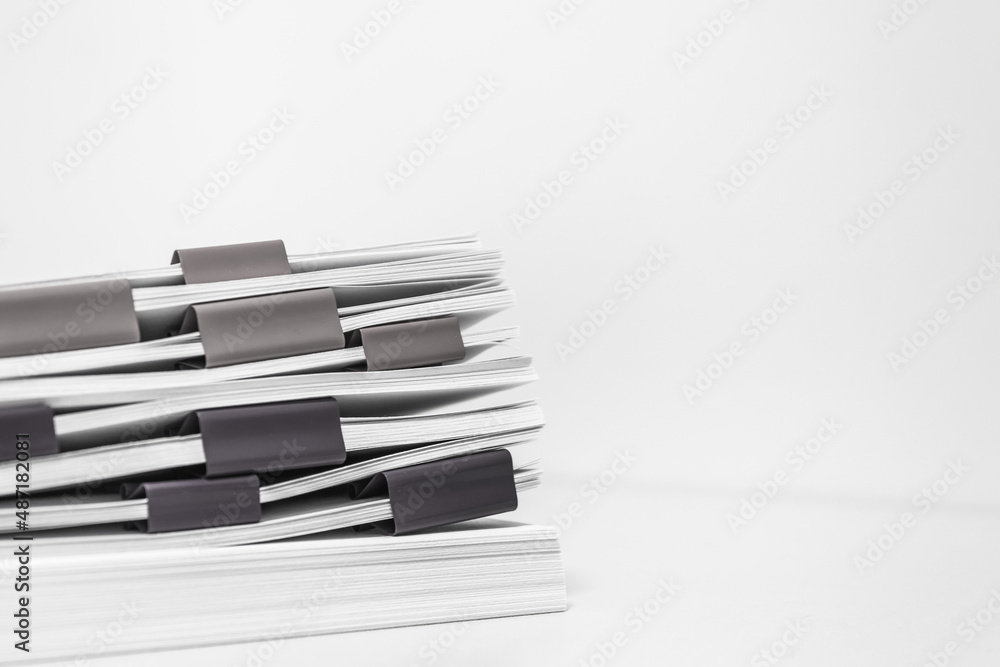 bundles bales of paper documents. stacks packs pile on the desk in the ...