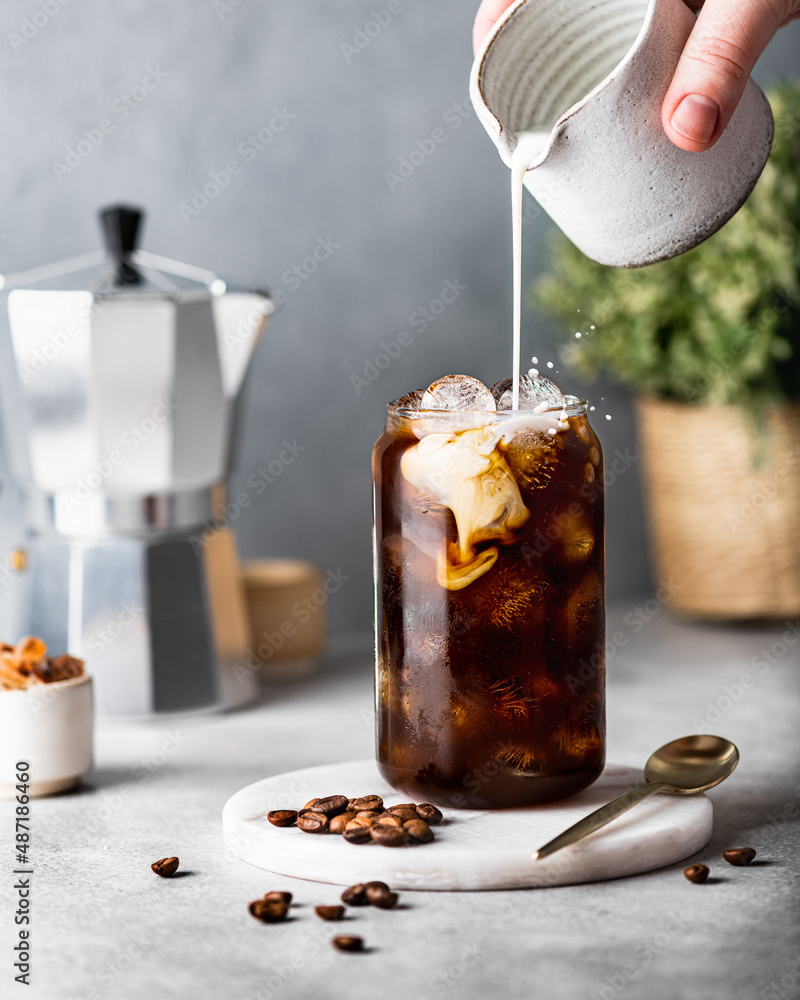 girl pouring milk into cold coffee, selective focus Stock Photo | Adobe ...