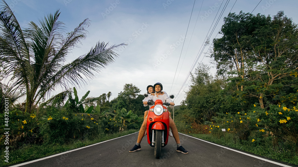 Scooter road trip. Love couple on red motorbike in white clothes on ...