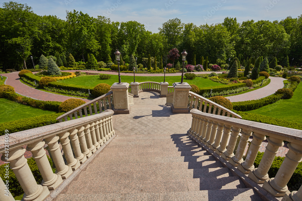 Stairs with stone railings balusters and iron lanterns on the ...