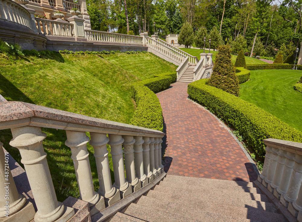 Stairs with stone railings balusters and iron lanterns on the ...