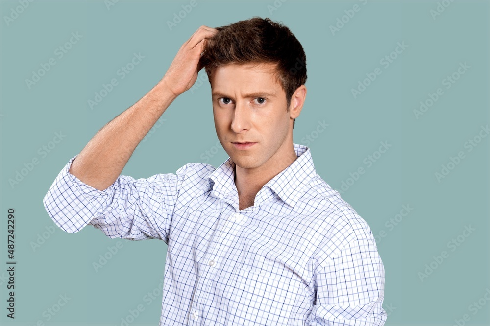 Young confused embarrassed sad puzzled man posing Stock Photo | Adobe Stock