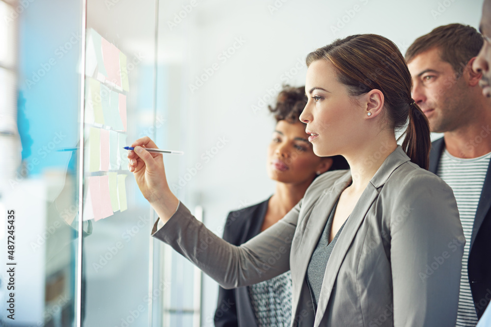 Their whole team is involved in executing a successful project. Shot of ...