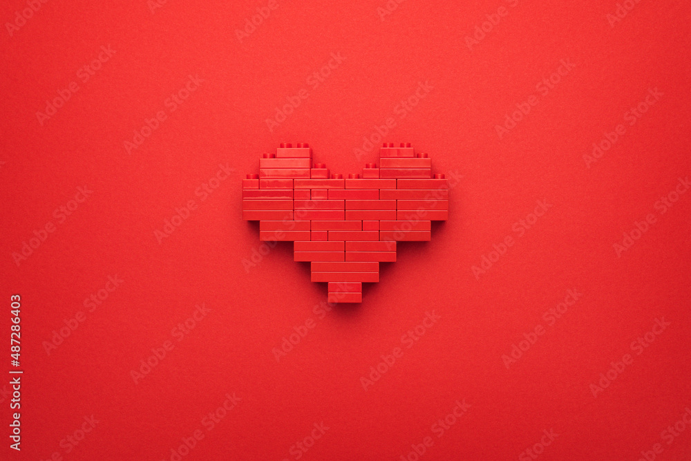 Red heart symbol made of plastic building blocks. Flat lay image of ...