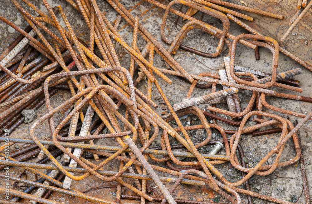 Rusty twisted metal rods bars or rebars. Background construction ...