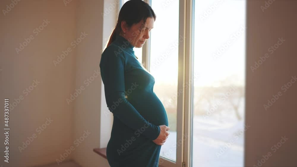 pregnant woman. motherhood a pregnancy concept sunset. 40 year old ...