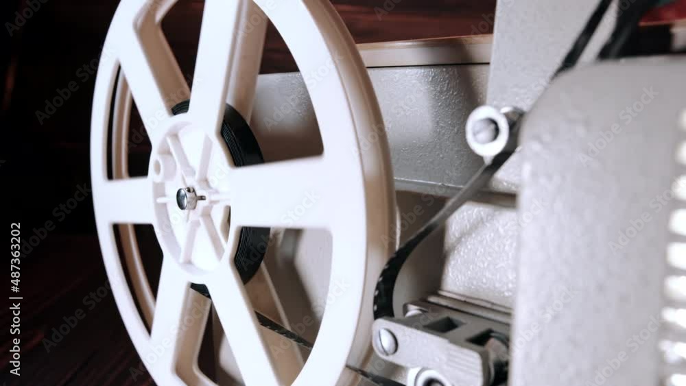 Footage of film reel turning. Analog player. Retro old-fashioned 8mm ...
