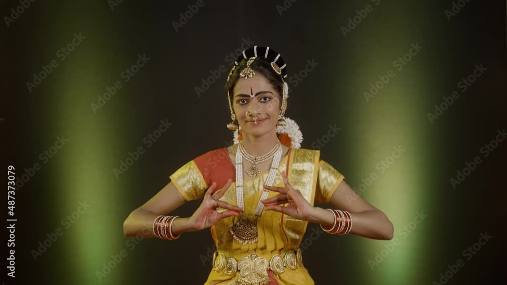 bharatanatyam dancer hands showing Avahittha hasta form or hand gesture while performing on ...