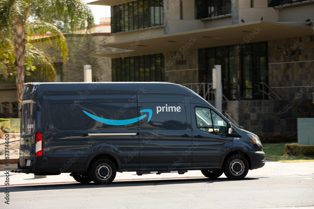 Fresno, California, USA - July 15, 2021: An Amazon Prime trucks makes a ...