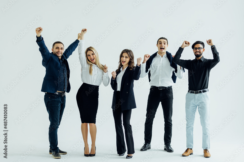 Business winners. Group of happy young people in formal wear ...