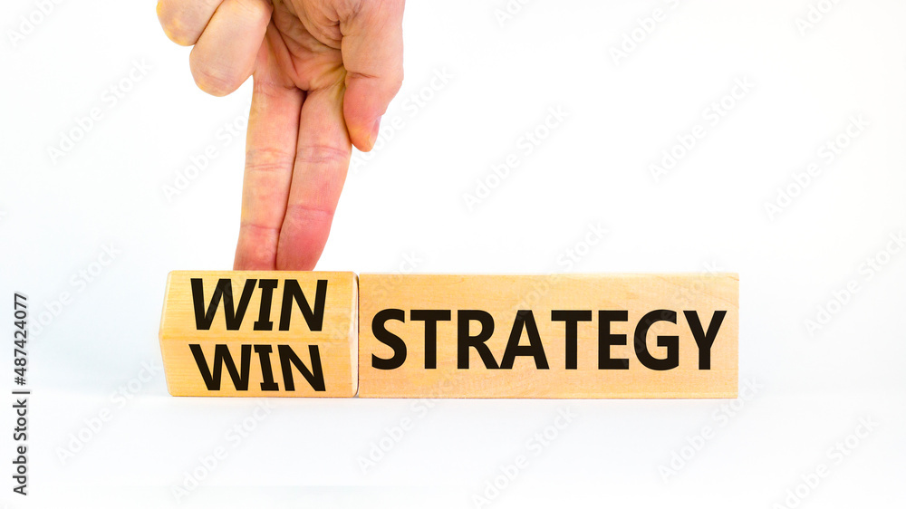 Win-win strategy symbol. Businessman turns wooden cubes with words win ...