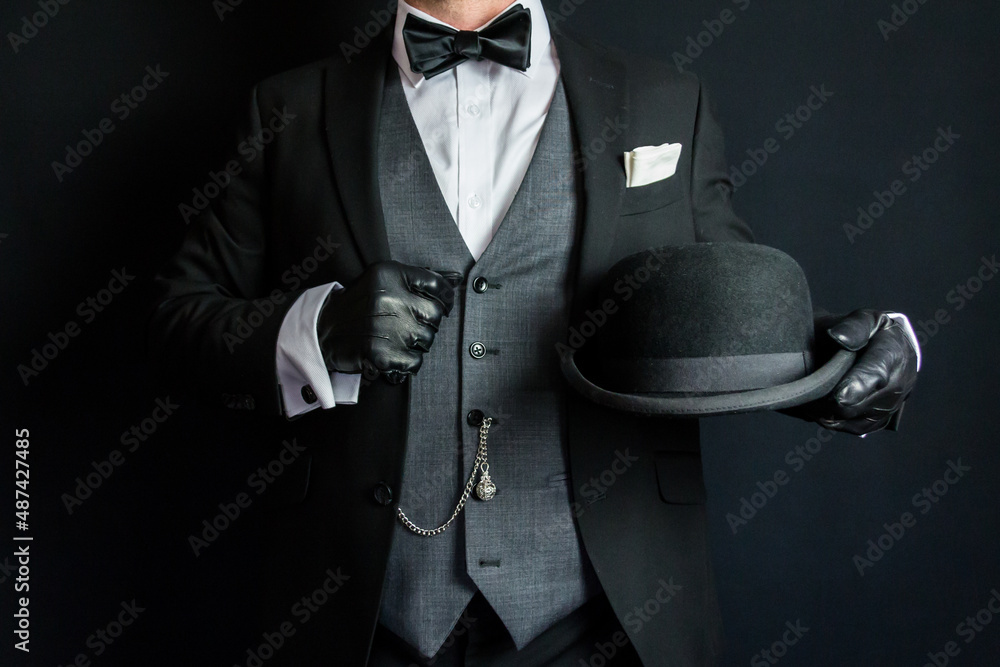 Portrait of Man in Dark Formal Suit and Leather Gloves Holding Bowler ...